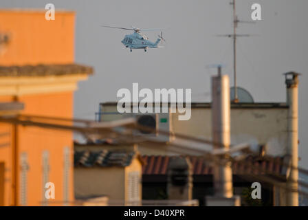 The helicopter carrying Pope Benedict XVI flies past St. Peter's ...