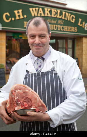Roger Wakeling Butcher with Cut of Meat outside his shop in Farncombe ...