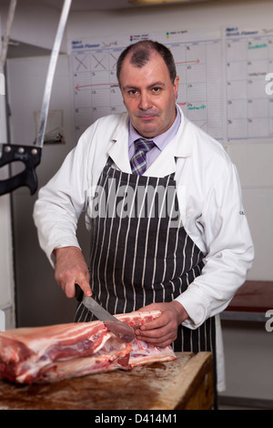 Roger Wakeling Butcher Cutting Meat Stock Photo - Alamy