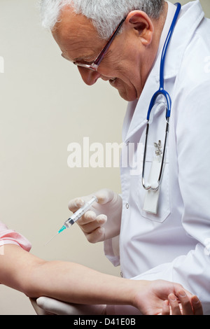 isolated sterilized injection syringe detail on a white background ...