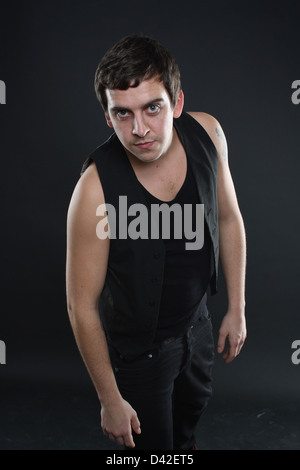 Man leaning forward towards the camera Stock Photo - Alamy