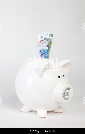 piggy bank with euro notes Stock Photo - Alamy