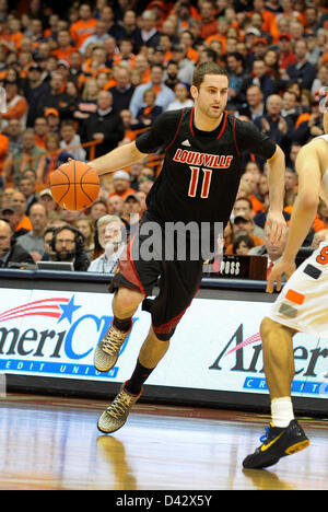 Luke Hancock (11) of Cardinals drives against Carl Hall (22) of Wichita ...