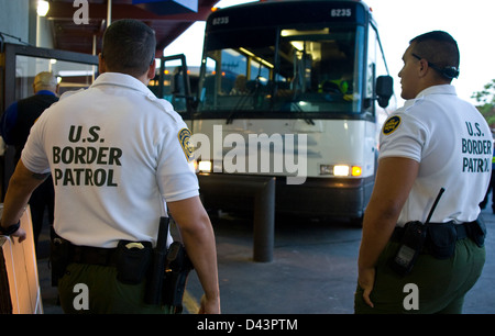 Federal immigration enforcement agents travel in SUVs near the shopping ...