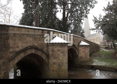 Winter snow, river Chater stone bridge, St Marys church, Ketton village ...
