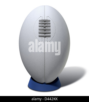 A plain white textured rugby ball on a green kicking tee in a stadium ...