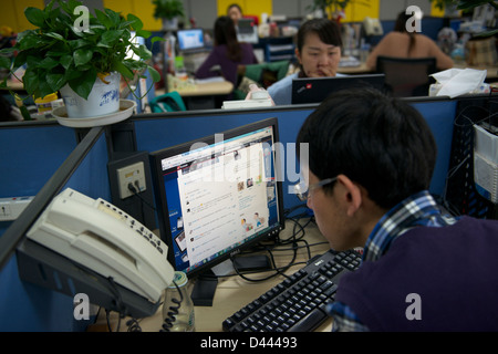 Chinese editors work at Sina's Weibo microblog office in Beijing, China ...