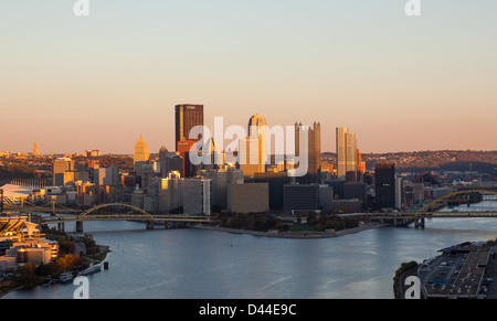 Setting sun highlights the tops of the tall buildings in downtown ...