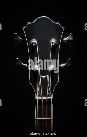 Head stock of a dark electrical bass guitar Stock Photo - Alamy