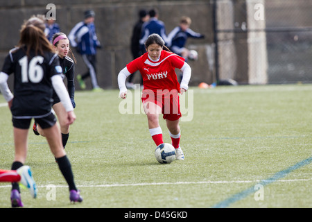 Teen girls soccer action Stock Photo - Alamy