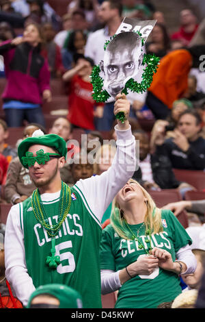 Boston Celtics fans cheer the team as they pass by during a parade ...