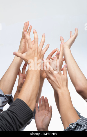 businessmen's hands up in the air trying to reach something Stock Photo ...