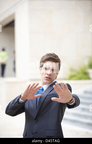 a western businessman with defending pose Stock Photo - Alamy