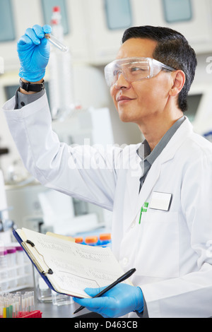 Male biotechnology scientist chemist working in the lab Stock Photo - Alamy