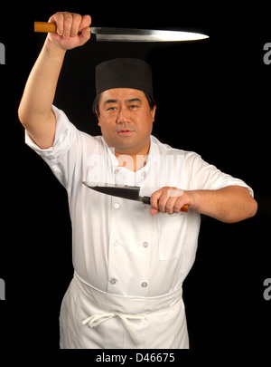 Male Japanese sushi chef posing with knives Stock Photo - Alamy