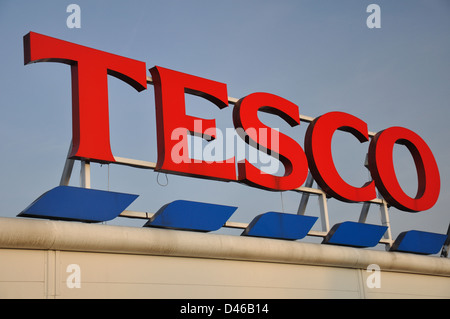 Tesco signs against a blue sky Stock Photo - Alamy
