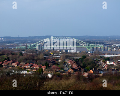 view from runcorn widnes bridge through arch of railway bridge to ...