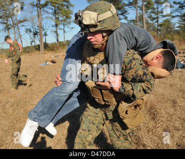 Marines establish a security perimeter during night raid training at a ...