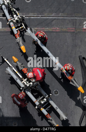 Aviation ordnancemen aboard the aircraft carrier USS CORAL SEA (CV-43 ...