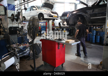 Car being serviced at a repair shop Stock Photo - Alamy