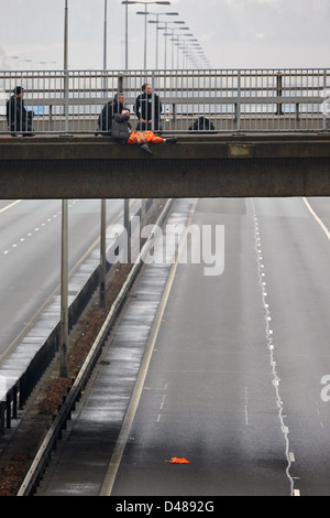 Police deal with a man who had climbed onto a bridge over the M40 ...
