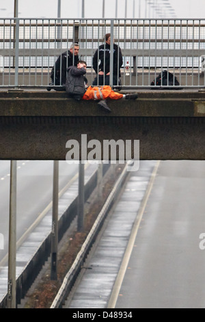 Police deal with a man who had climbed onto a bridge over the M40 ...
