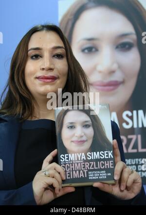 Semiya Simsek, daughter of the first NSU victim Enver Simsek, shows her ...