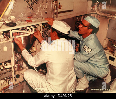 NASA workers inspecting Apollo Capsule Stock Photo - Alamy