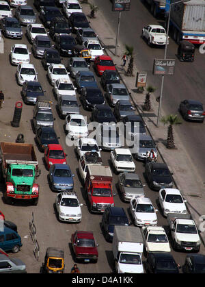 Cairo, Egypt. 10th March, 2013. Egyptians microbus drivers park their ...