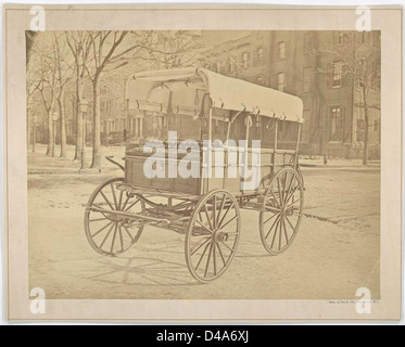 This 1869 photograph shows a Howard ambulance with its tailgate down ...