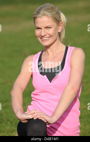 Woman stretching in the park Stock Photo - Alamy