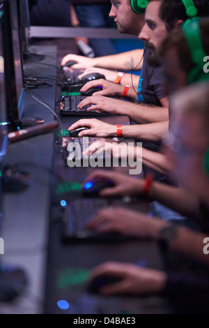 Visitors try out an unreleased computer game at the Eurogamer Expo in ...