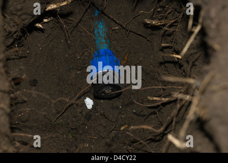A blue alkathene water pipe capped off in a trench Stock Photo - Alamy
