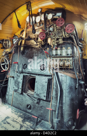 a steam locomotive engine room with the boiler and valves Stock Photo ...