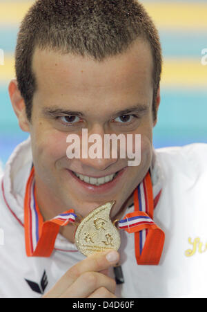 Markus Rogan of Austria poses with his gold medal for winning the Men's ...