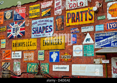 Collection of old metal signs displayed on the wall of an former ...