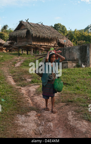Khmu hill tribe, old woman sitting in door of her house, Luang Prabang ...