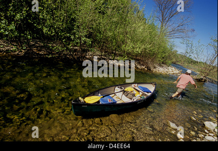 Man fishing for bass from a canoe on the Blanco River Texas Stock Photo ...