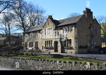 The Pendle Inn in winter sunshine in the village of Barley with a snow ...