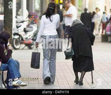 Old women walking stooped in street Stock Photo - Alamy