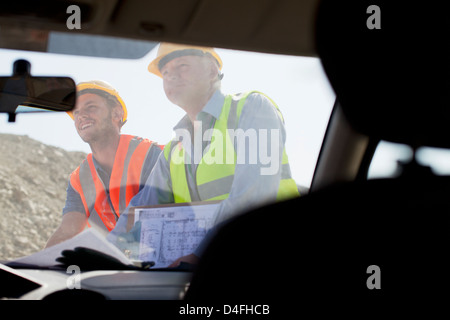Young businessman with helmet drawing on virutal screen Stock Photo - Alamy