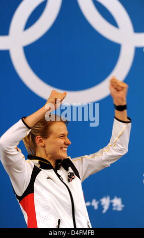 Britta Heidemann from Germany celebratres with her goldmedal after ...