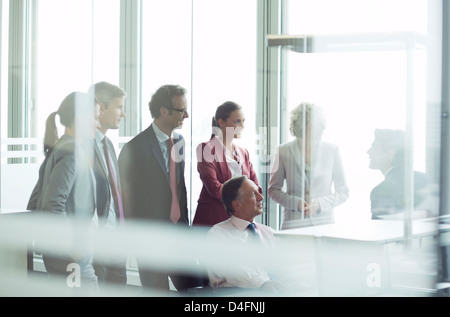 Business people talking on a meeting sitting in modern office ...