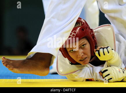 Helena Fromm of Germany lies on the ground during her fight against ...