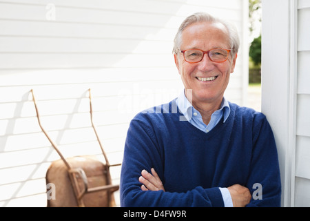 Man smiling outside house Stock Photo - Alamy