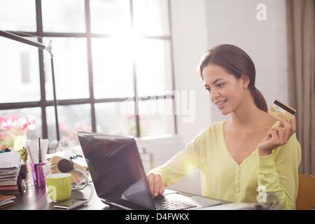 Young latin woman ecommerce business worker standing with arms crossed ...