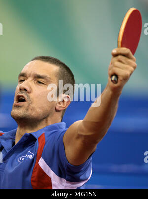 French table tennis player Christophe Durand poses with his gold medal ...