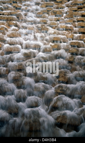Fountain Water Running Over Stones Stock Photo - Alamy