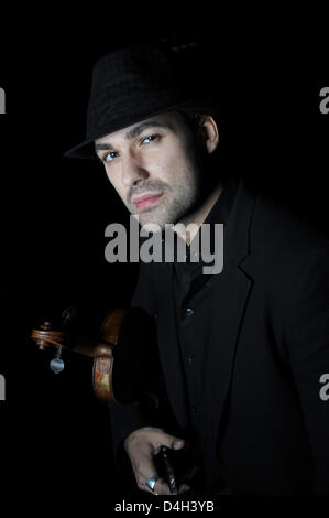Violinist David Garrett smiles during a press conference in Cologne ...