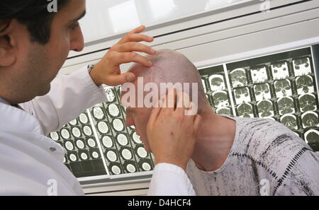 Neurosurgeon Amir Samii (L), Assistant Director of International ...